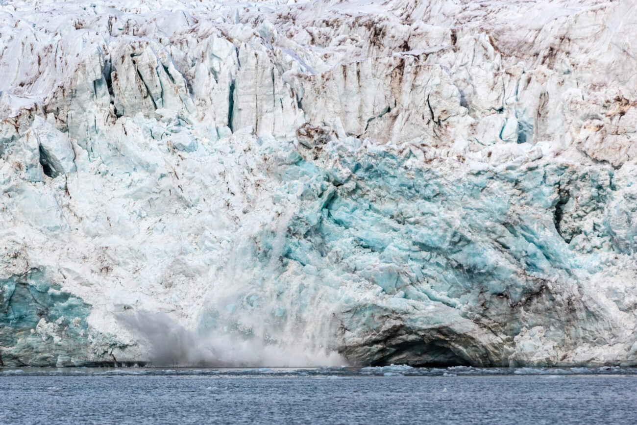 Calving ice of a massive glacier at Svalbard | Nature of Healing